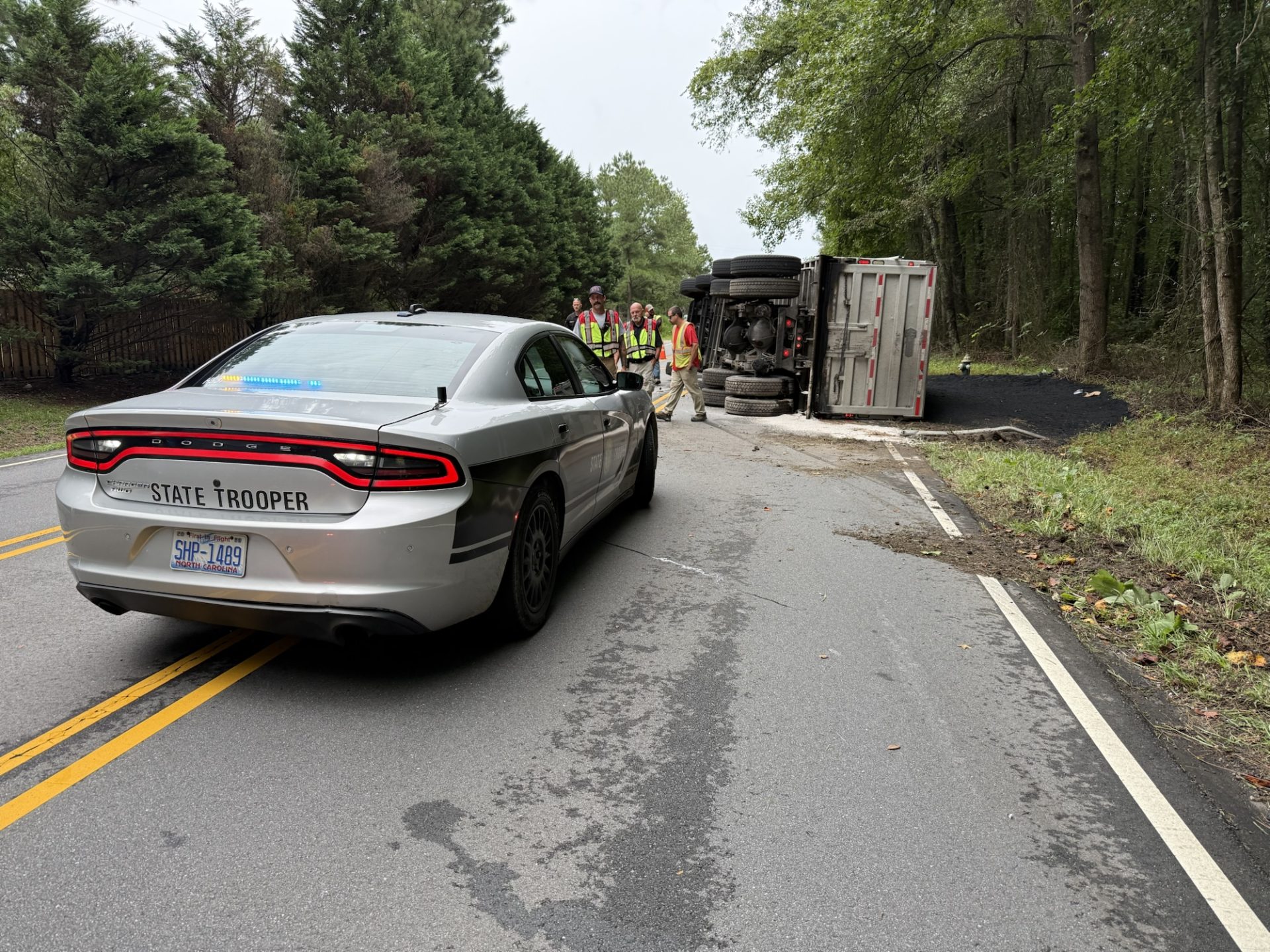 Dump truck hauling asphalt overturns, traffic detoured near Whispering ...